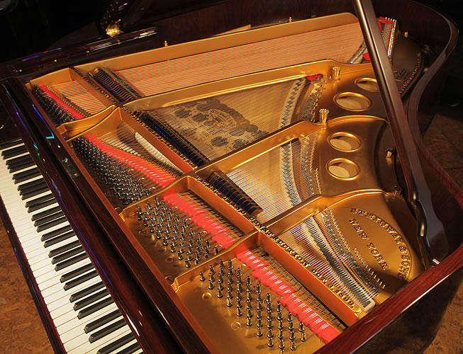 A Steinway Model O Grand piano with a rosewood case and spade legs ...