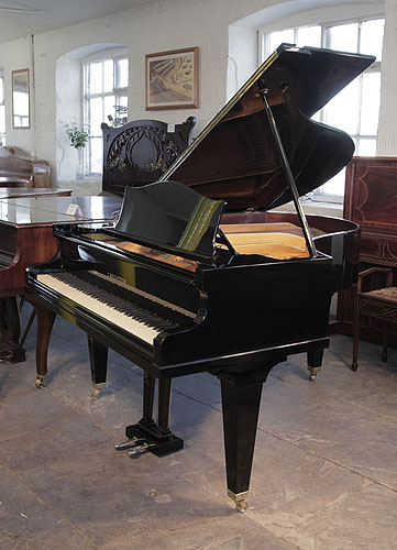 Rebuilt, 1935, Bechstein Model L grand piano with a black case and ...